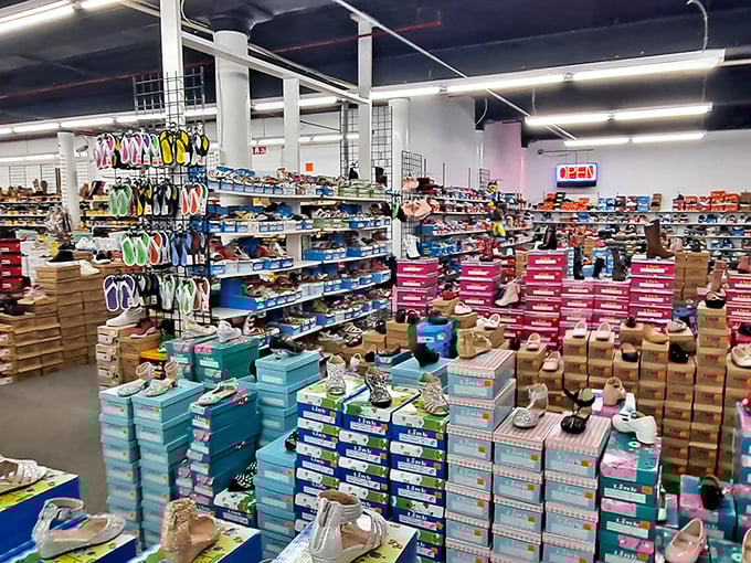 If Imelda Marcos had a dream, this would be it. Rows upon rows of footwear await their Cinderella moment. Who knew salvation could come in the form of discount shoes?