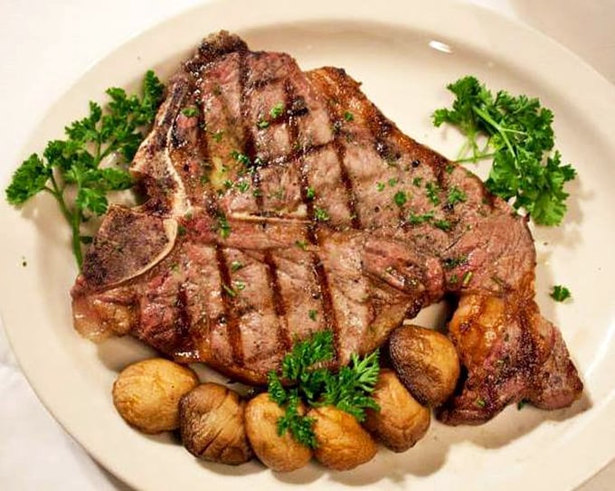 Behold, the pièce de résistance! This perfectly grilled steak, adorned with roasted potatoes and parsley, is ready for its close-up. And your fork.