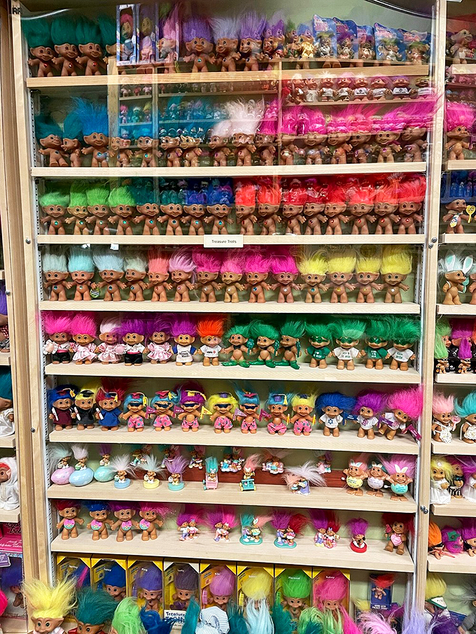 Behold the rainbow of rebellion! These shelves showcase more hair-raising personalities than a retirement home on bingo night.