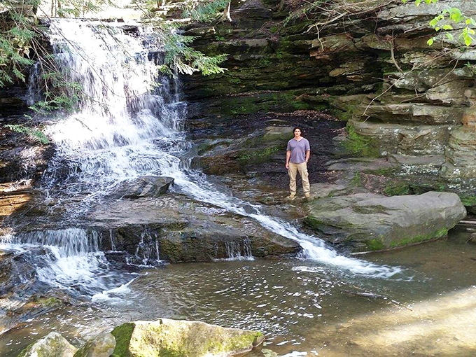 "I came, I saw, I got slightly damp." One visitor's triumphant pose at the base of Honey Run's liquid curtain.