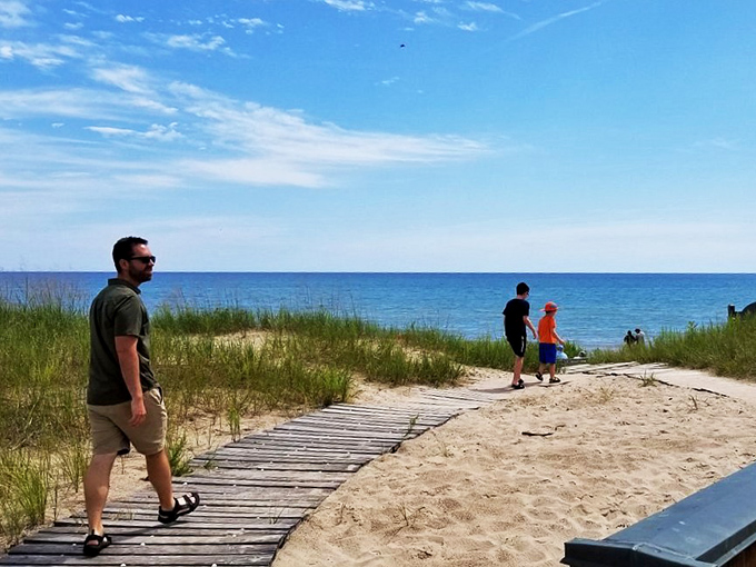 Beach day, anyone? This wooden walkway is like nature's red carpet, leading straight to Lake Michigan's refreshing embrace.