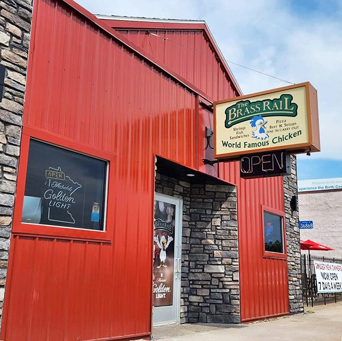 Red alert for rumbling tummies! The Brass Rail's vibrant exterior is like a lighthouse for the famished. Prepare for a chicken-induced flavor explosion!