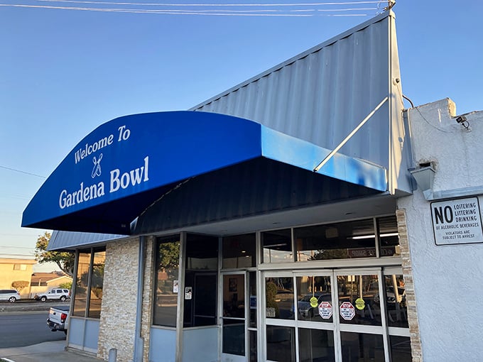 Welcome to Gardena Bowl, where aloha spirit meets bowling fever! This blue awning beckons like a tropical wave.