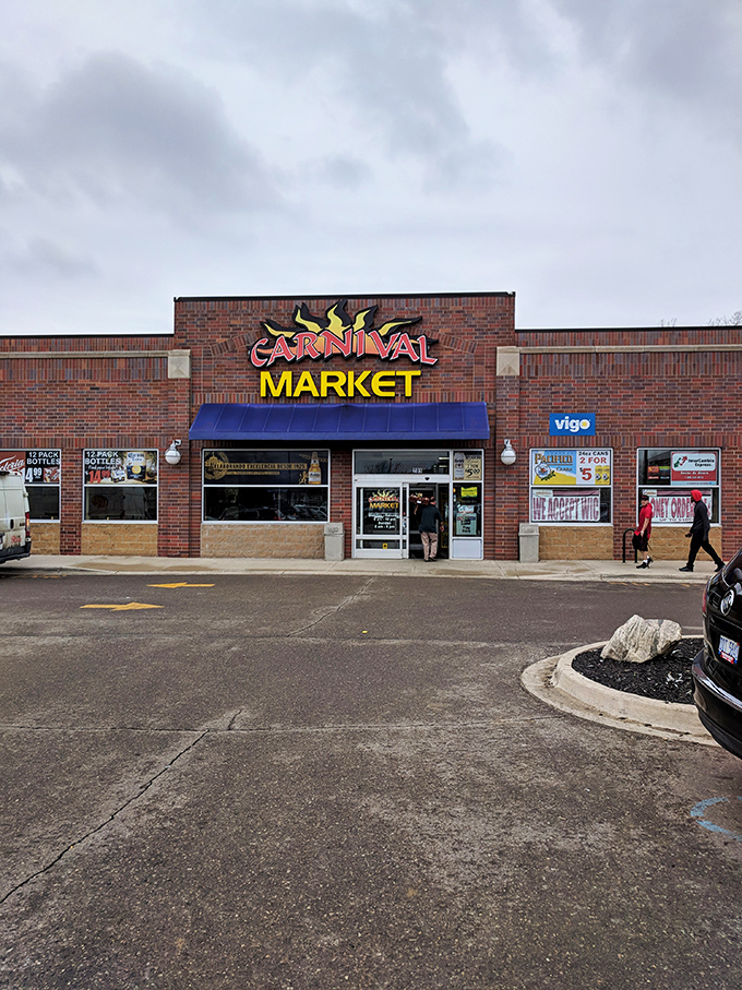 Pontiac's party central! Carnival Market's sign promises a fiesta of flavors that'll make your shopping cart do the conga.