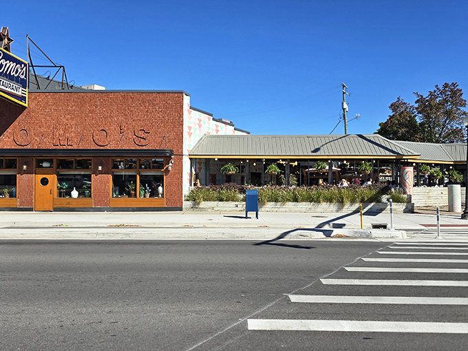 Sunshine or starlight, Como's is always right. This daytime shot shows off the restaurant's inviting patio and brick charm.