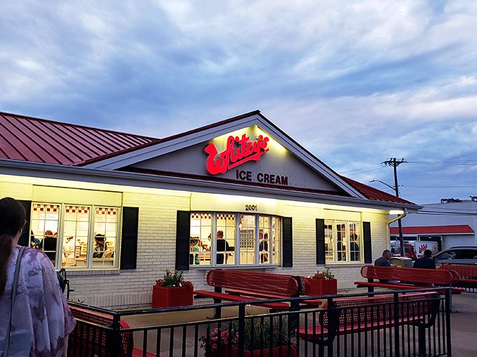 Twilight delight at Whitey's! As day fades, this ice cream oasis glows with the promise of frosty treats and childhood memories.