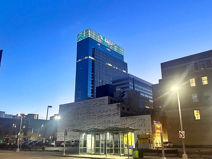 Night falls, but the music plays on. The Music Wall takes on a magical glow after dark, like a nocturne in brick and mortar.