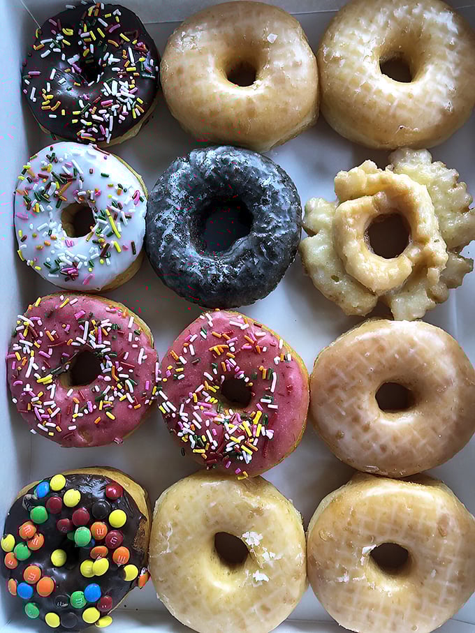A box of joy that puts Pandora's to shame. These donuts are so colorful, they could moonlight as modern art!