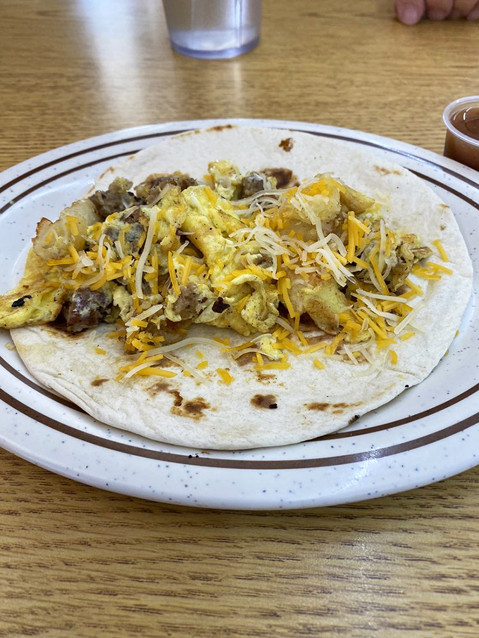 Breakfast rebellion in tortilla form. This taco laughs in the face of conventional morning fare, proving everything's better when it's handheld.