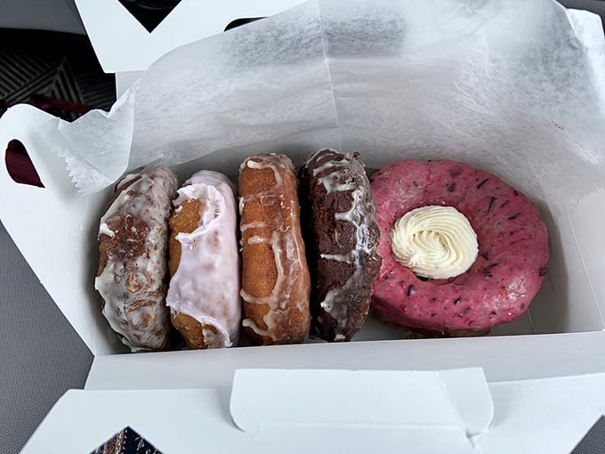 A rainbow of deliciousness! This box of donuts is like the Avengers of pastries &ndash; each one bringing its own superpower of flavor to save your taste buds from boredom.