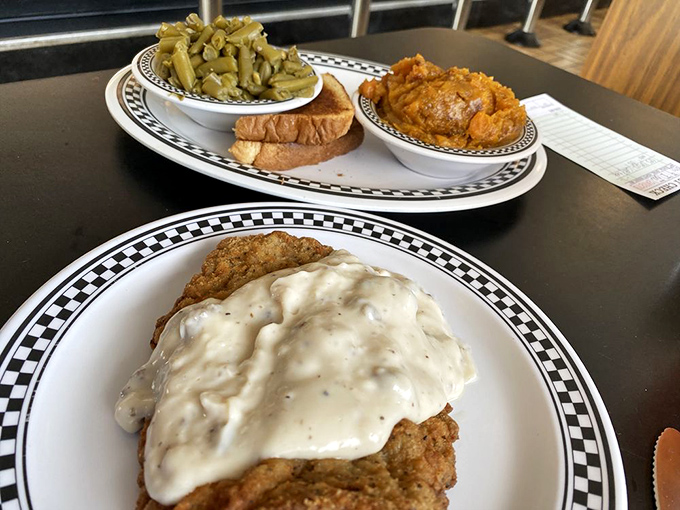A plate that screams "cheat day" louder than your conscience. This country fried steak is worth every delicious calorie.