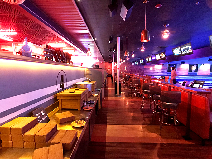 Dine and strike! This cozy nook offers the perfect vantage point to enjoy a burger while watching bowling balls fly.
