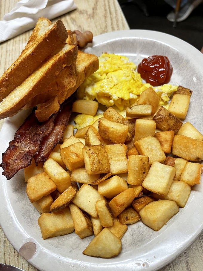 The holy trinity of breakfast: Eggs, bacon, and potatoes. It's like a hug for your stomach, served with a side of morning glory.