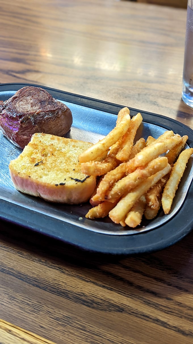 Filet mignon perfection: So tender, you could cut it with a harsh word. Paired with golden fries and buttery garlic bread.