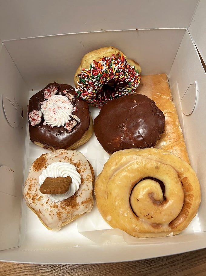 A box of happiness awaits! From classic glazed to chocolate-covered wonders, it's like a greatest hits album for your mouth.