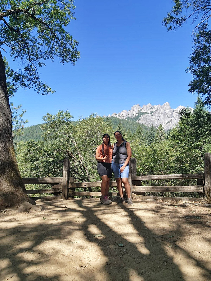 Two adventurers pause to soak in the view. In the background, Castle Crags plays hard to get, peeking out from behind the trees.