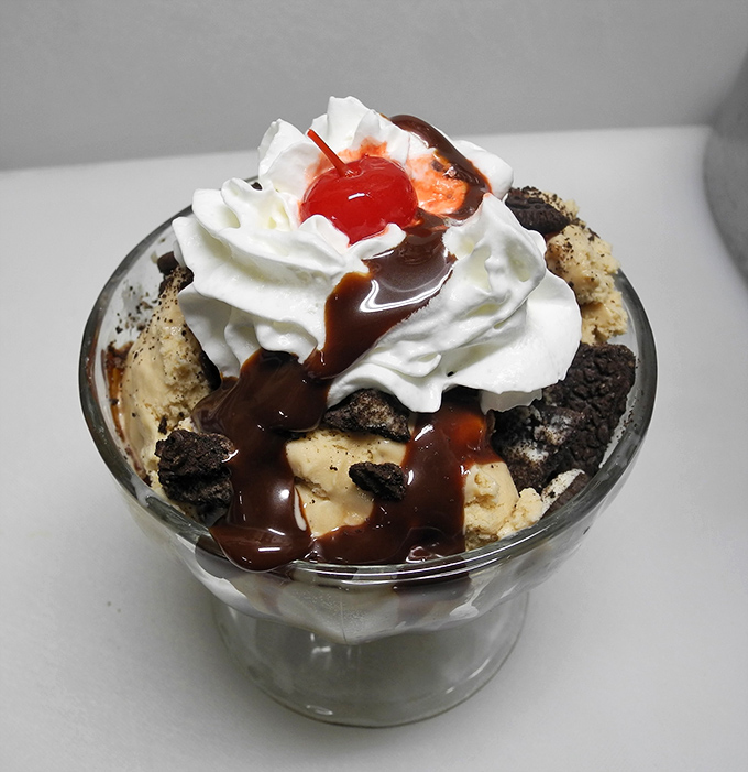 Holy hot fudge, Batman! This sundae is stacked higher than my college textbooks, but infinitely more enjoyable to dive into.