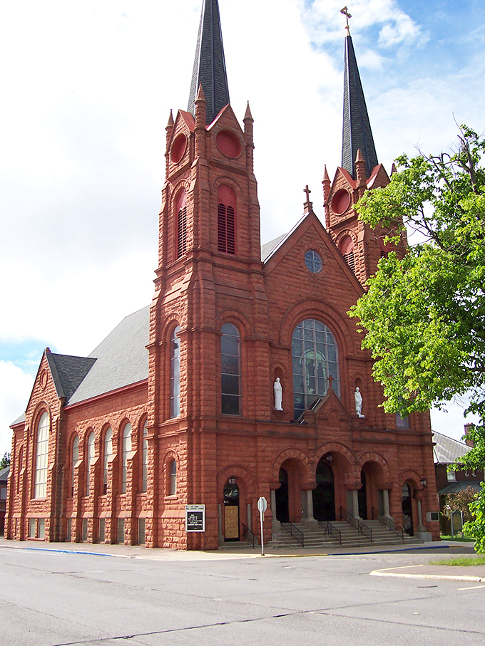 Holy copper, Batman! St. Paul the Apostle Church stands as a red-bricked beacon of faith, its twin spires reaching skyward like a miner's pickaxe.