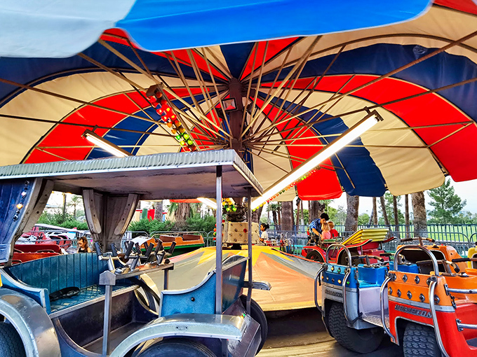 Colorful umbrellas and smiling faces - this ride is like Mary Poppins meets NASCAR, minus the tea parties and pit stops.