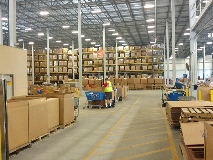 Behind the scenes of bargain magic: Goodwill's hardworking elves keep the treasure hunt alive, restocking bins with fresh finds.