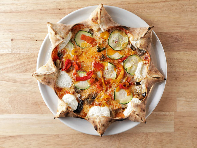 A pizza that's more colorful than a Miami Beach sunset. It's like an edible Jackson Pollock, but tastier!