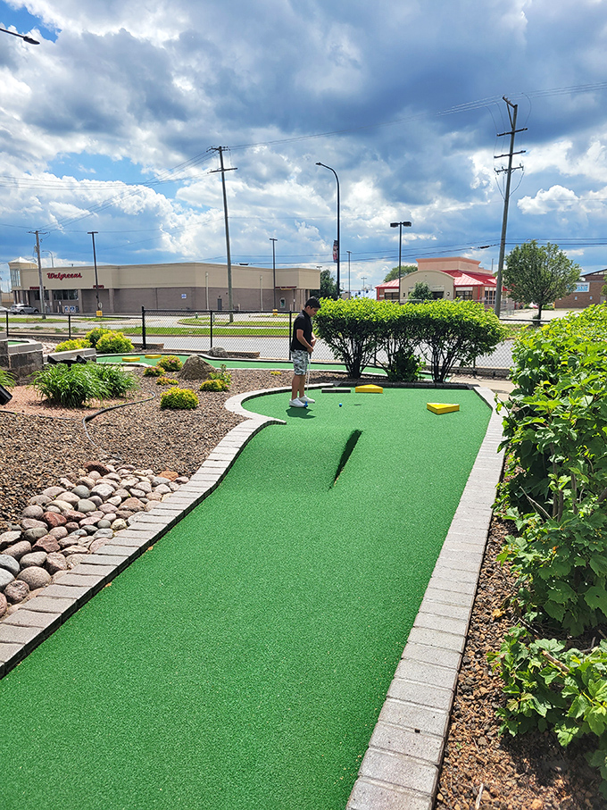 "Putting her way to victory! This little ghost-buster-in-training shows that even the spookiest course is no match for determination and a good swing."