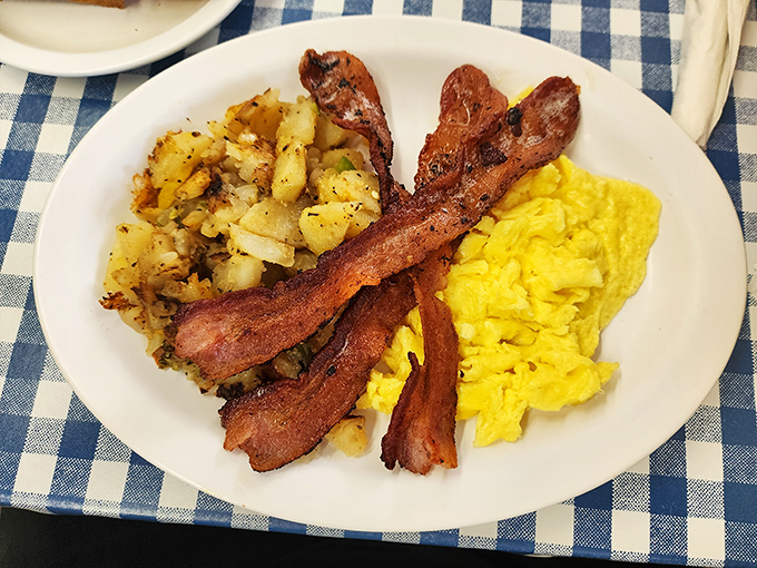 Bacon, eggs, and home fries: the holy trinity of breakfast. This plate is so perfectly arranged, it could be in a diner food museum.