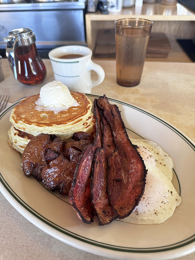 Pancakes, bacon, and eggs: the holy trinity of breakfast. This plate could fuel a marathon... or a really satisfying nap.