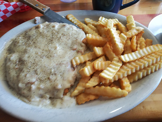 Golden fries and gravy-smothered goodness. This plate is what cheat days dream about at night.