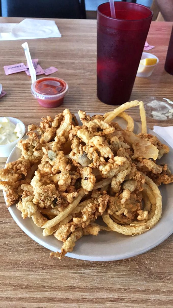 The holy trinity of seafood satisfaction! Clam strips, onion rings, and fries - a combo that's music to your taste buds.