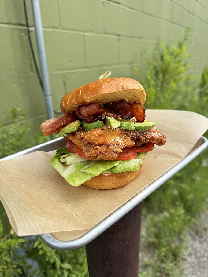 The Cluckin' Honey BLT: Where bacon meets its match in a crispy chicken showdown. It's a sandwich that would make even Elvis say, "Thank you, thank you very much."