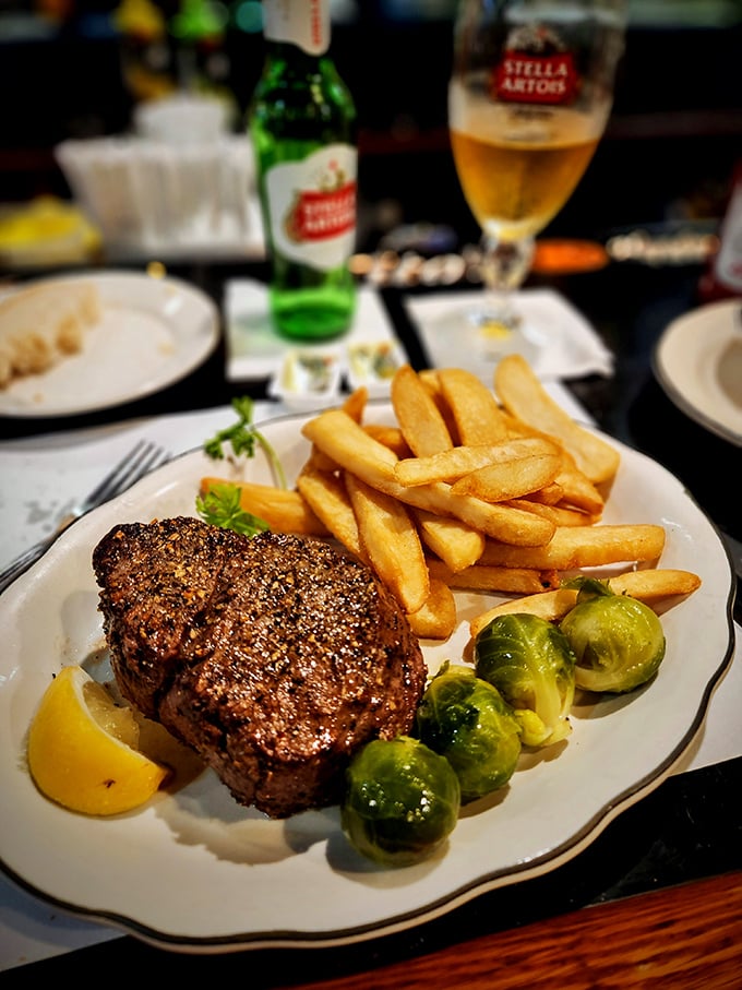 Steak perfection, served with a side of golden fries and vibrant veggies. It's a plate that screams "treat yo' self!"