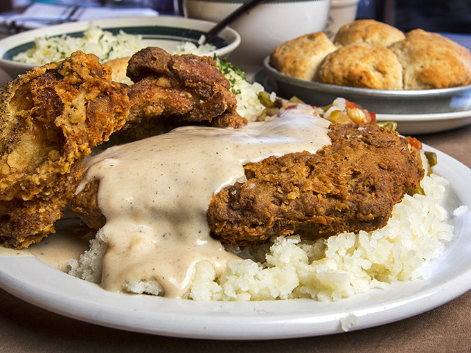 A plate that screams "Happiness!" Crispy chicken, creamy potatoes, and gravy &ndash; it's like a warm hug for your taste buds.