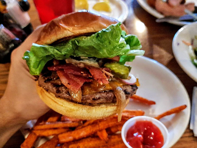 Hold onto your taste buds! This Grizzly burger is stacked higher than your grandkid's Lego tower and twice as impressive.