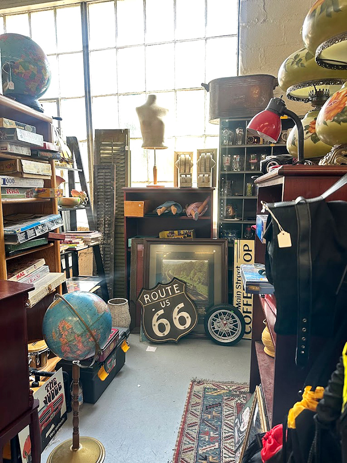 Route 66 meets Antiques Roadshow in this corner. It's a time capsule of Americana, complete with globes, shutters, and road trip memorabilia.