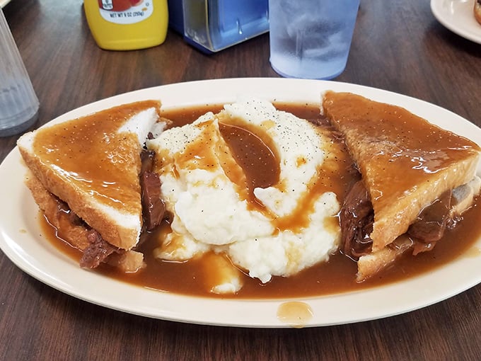 Behold the "Heartland Special"! Mashed potatoes swimming in gravy, nestled next to golden toast. It's a carb lover's dream and a nutritionist's nightmare &ndash; but oh so worth it.