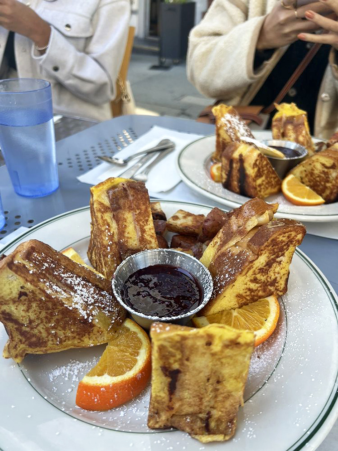 Behold, the dynamic duo! Golden Monte Cristo triangles and their faithful sidekick, homemade jam. Name a more iconic pair, I'll wait.