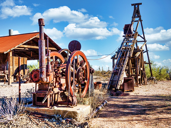 Rusted relics of the mining boom stand silent sentinel. These mechanical mastodons once shook the earth in the quest for golden treasures.