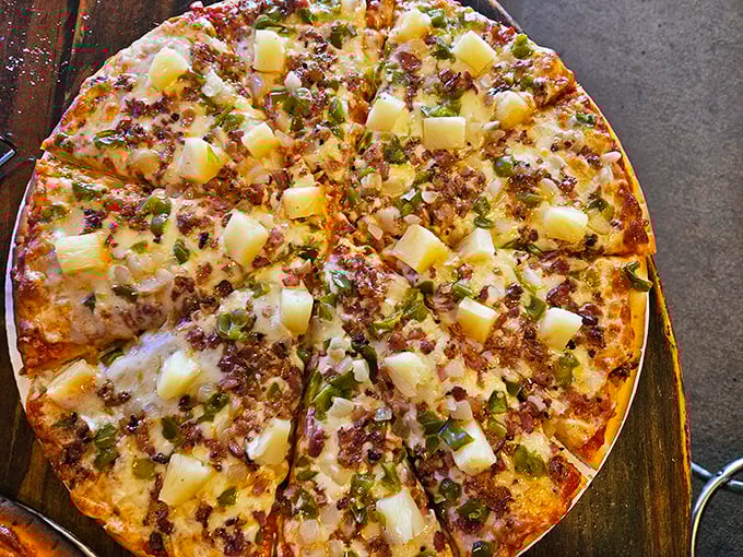 Toppings galore! This pie's loaded like a prospector's mule – a true mother lode of flavors.