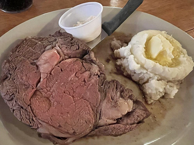 Prime rib perfection! This succulent slice of heaven, paired with creamy mashed potatoes, is the comfort food equivalent of a warm blanket on a chilly day.
