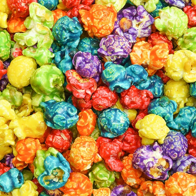 Taste the rainbow? Pfft. Here, you can taste the entire color spectrum in popcorn form. It's like edible confetti for your mouth!