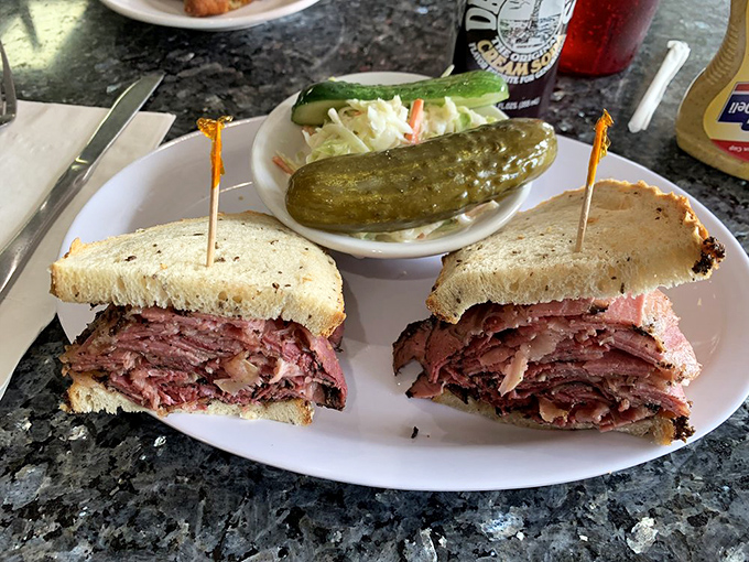 Meat mountain ahoy! This Reuben sandwich is stacked higher than your grandpa's stories about walking uphill both ways to school.