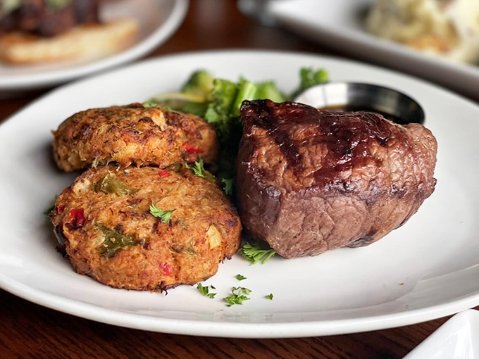 The ultimate power couple: steak and crab cakes. It's like Romeo and Juliet, but with a much happier ending &ndash; and a side of saut&eacute;ed mushrooms!