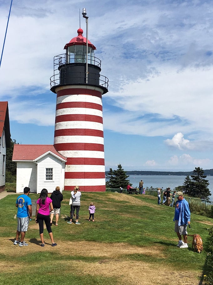 Lighthouse groupies unite! Visitors flock to this striped wonder like seagulls to a dropped ice cream cone.