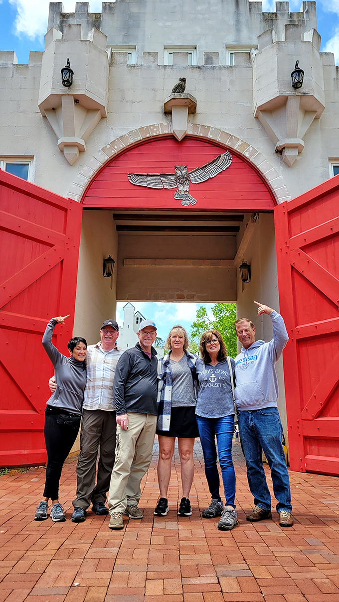 Say cheese and long live the king! These visitors are living their best castle life, complete with mandatory silly poses at the entrance.