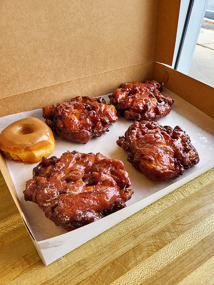 Apple fritters: nature's way of saying "You deserve this." These golden-brown beauties are like edible autumn, crispy outside, gooey inside.