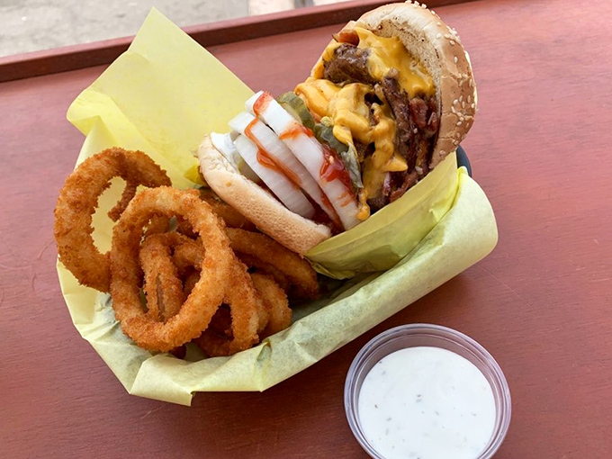 Bacon lovers, rejoice! This burger's bacon blanket ensures every bite is a crispy, juicy symphony of flavors.