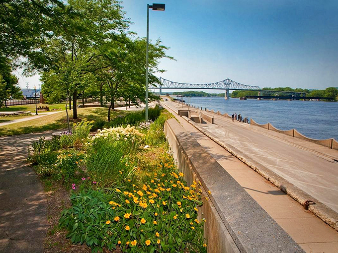 Riverside promenade: Where flowers and fitness meet. It's like someone rolled out a welcome mat for the Mississippi.