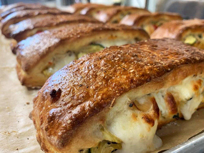 Holy brioche, Batman! These golden beauties are so stuffed with cheesy goodness, they might need their own zip code.