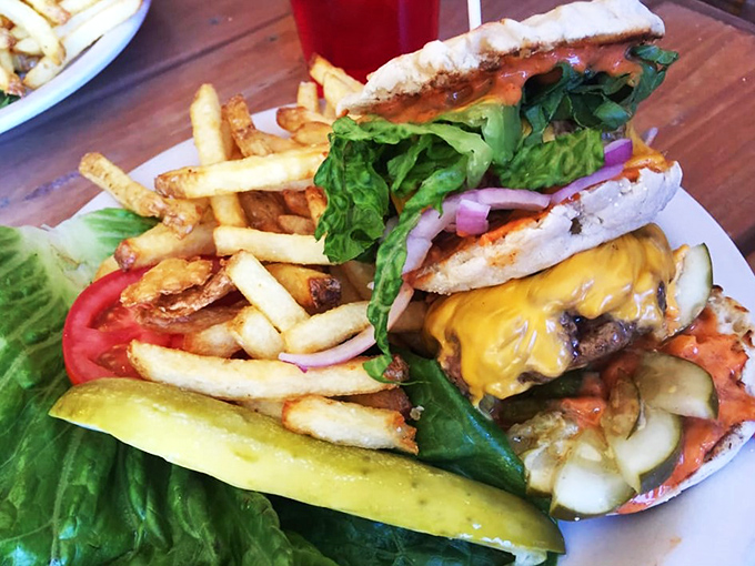 Hold onto your hats, folks! This burger's stacked higher than a Jenga tower on steroids.